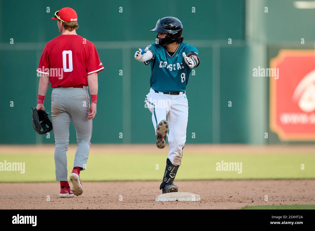 Coastal Carolina Chanticleers Dean Mihos (8) celebrates hitting a ...