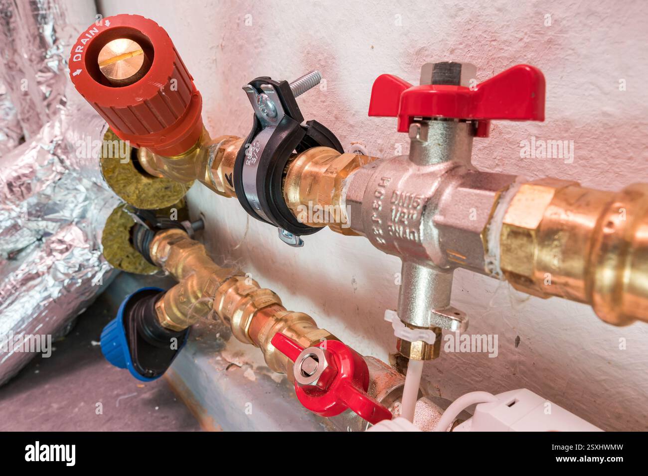 construction of a central hot water heating system in the basement of a ...