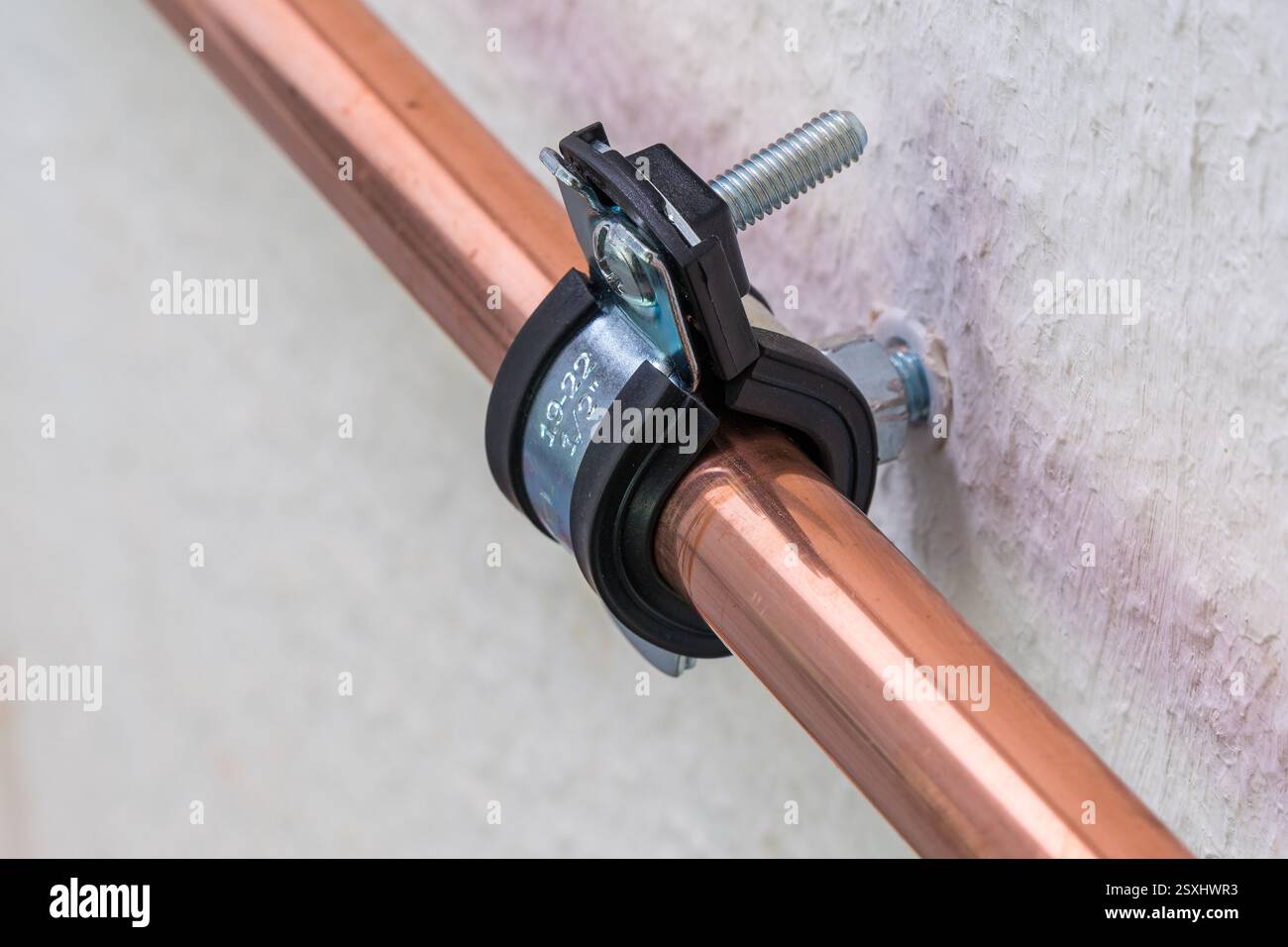 Mounted Copper Pipe with Wall Clamp and Hex Bolt – Side View Stock ...