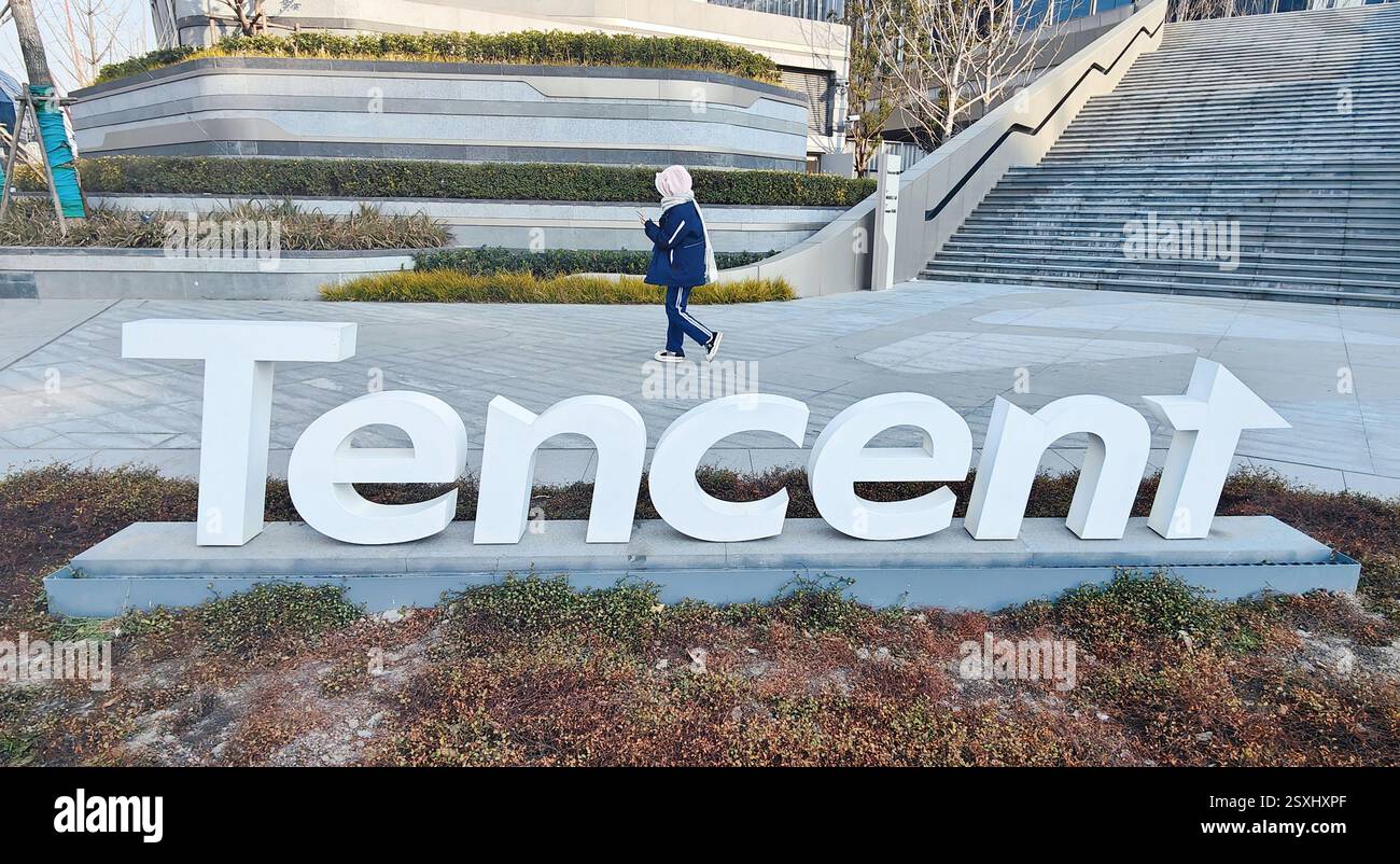 SHANGHAI, CHINA - FEBRUARY 24, 2025 - A pedestrian passes the Tencent ...
