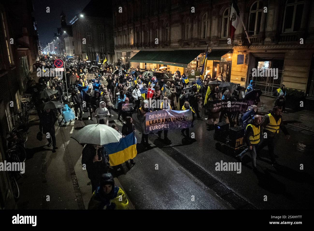 People participate in a march marking the third anniversary of Russia's ...