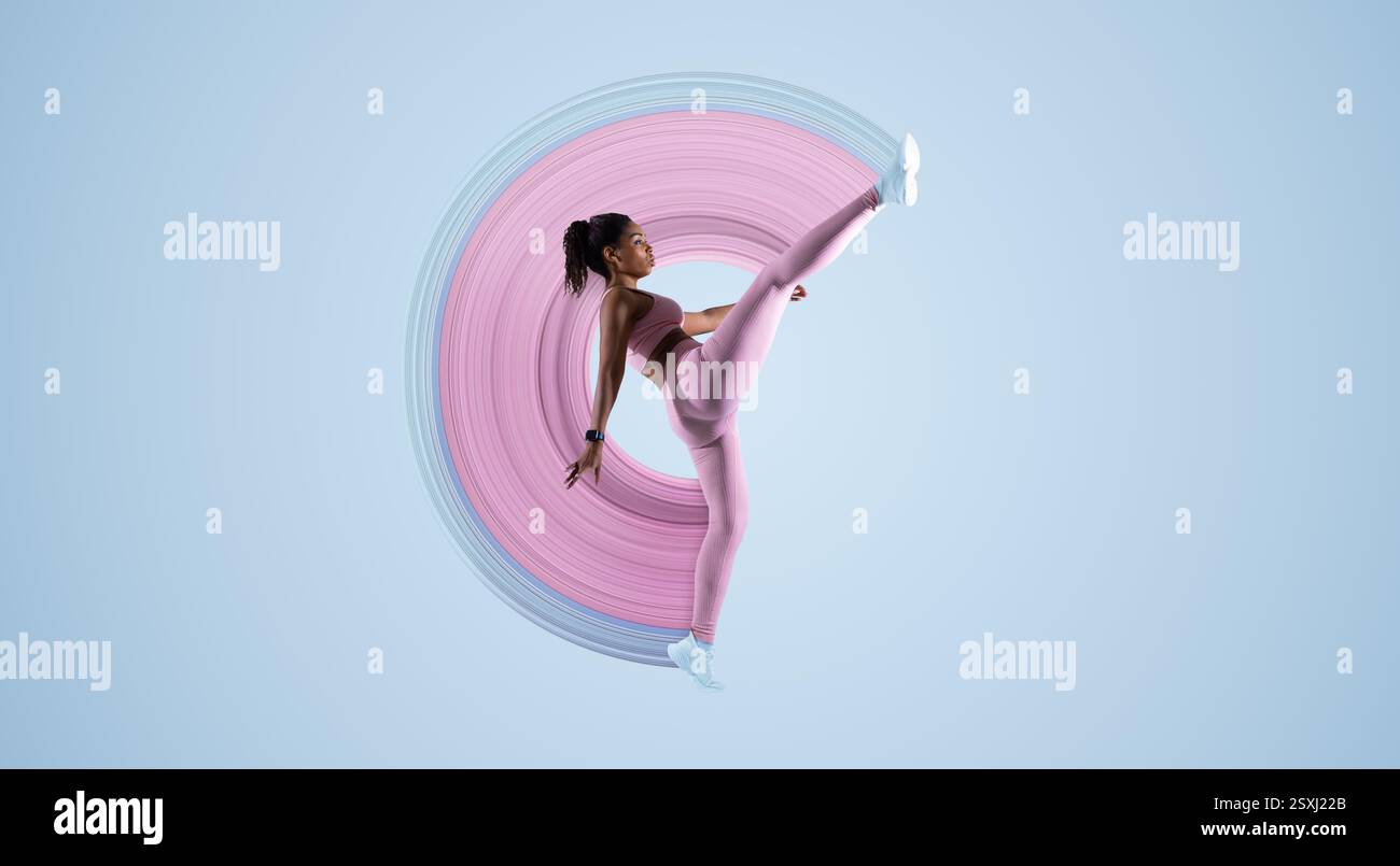 Motivated lady doing karate kick move, raising leg and showing perfect ...