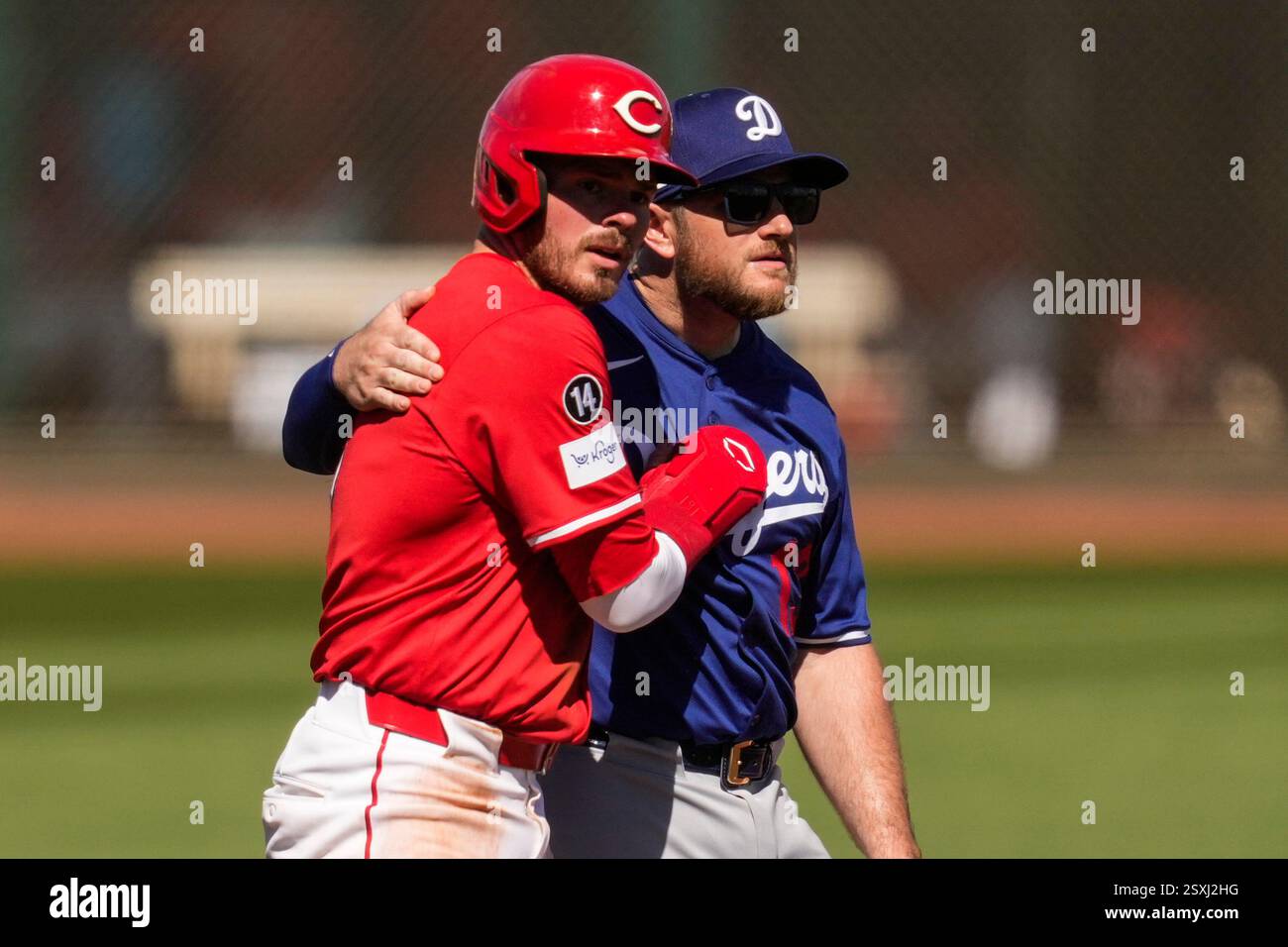 Cincinnati Reds' Gavin Lux, left, hugs Los Angeles Dodgers third ...