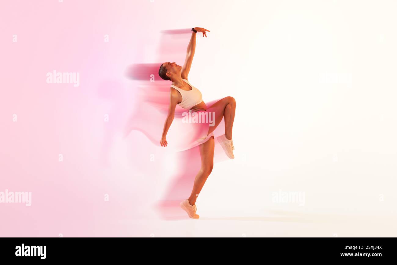 An exuberant young dancer in a dynamic pose captures the essence of movement and grace Stock ...