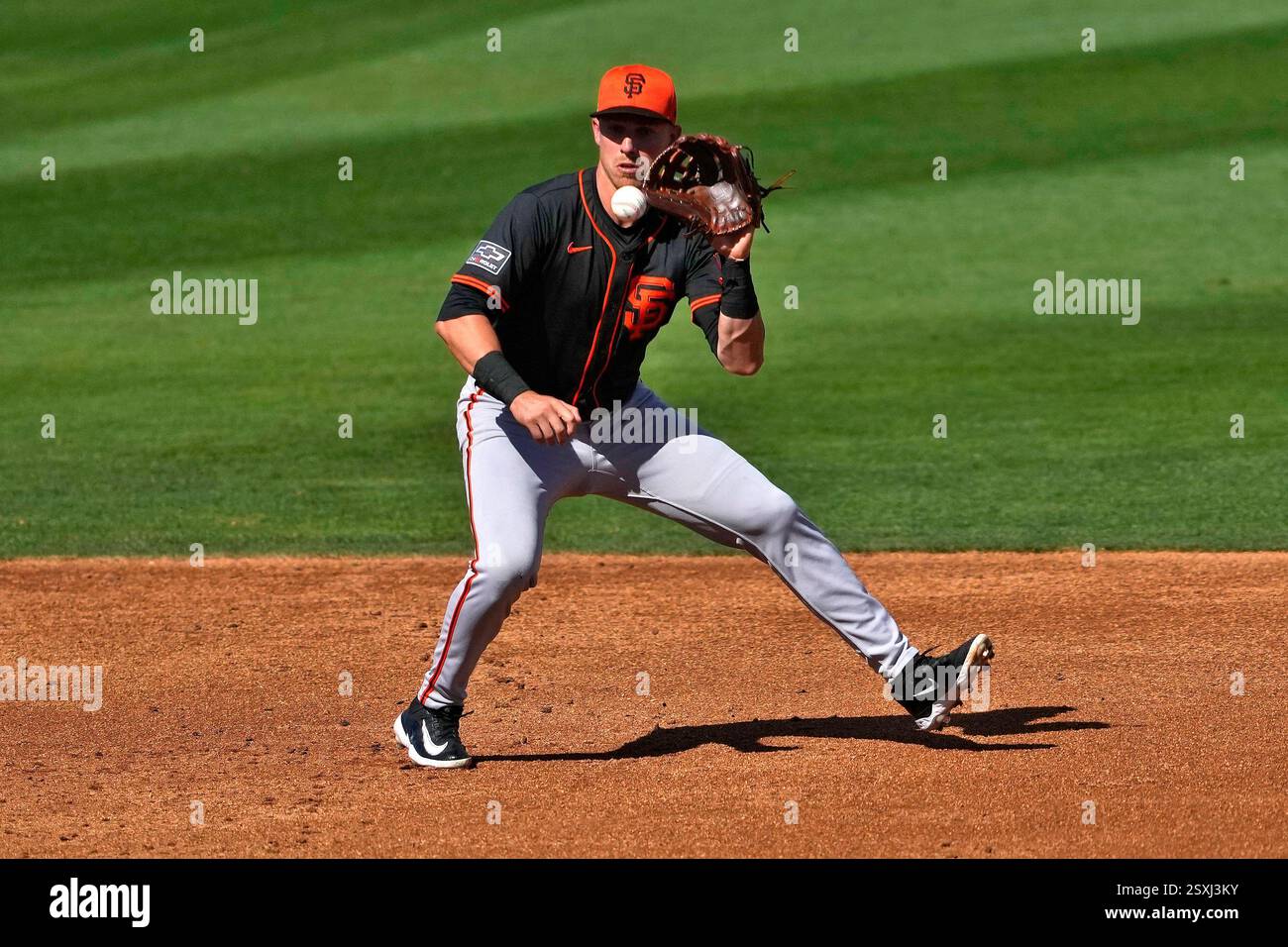 San Francisco Giants' Jake Lamb fields a ground out hit by Los Angeles ...