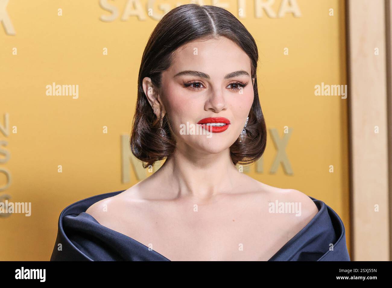 LOS ANGELES, CALIFORNIA, USA - FEBRUARY 23: Selena Gomez wearing a custom Celine dress, Jimmy ...