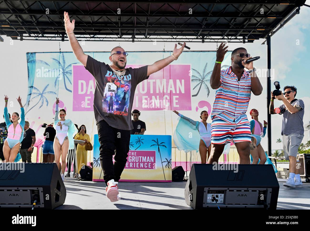 David Einhorn, left, and DJ Irie appear on stage during 3 to 5 on Ocean ...