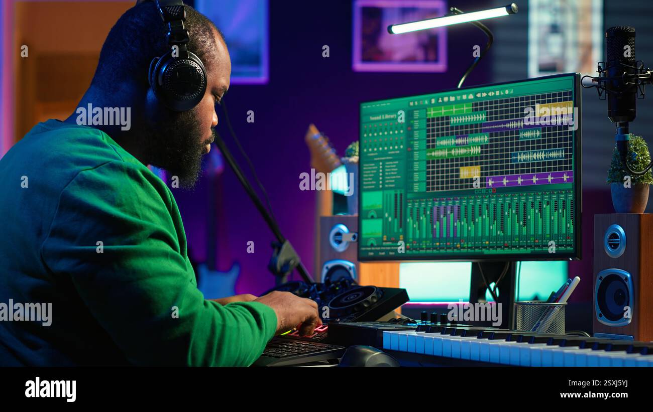 Skilled audio technician editing recorded tracks from an usb stick ...