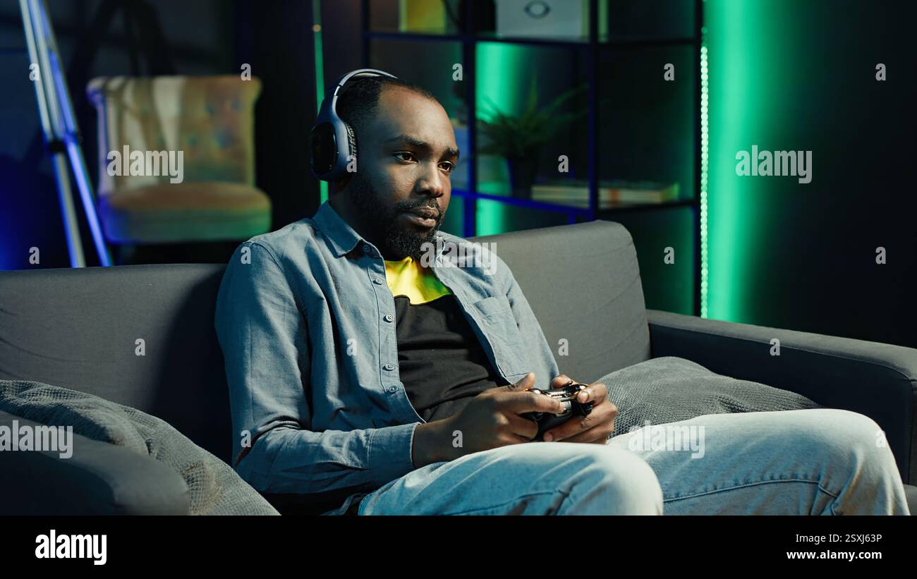 Tired gamer in rgb hi-res stock photography and images - Alamy