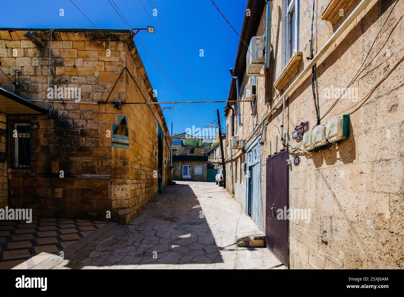 Old houses on low-rise street in old part of Derbent city in Russia ...