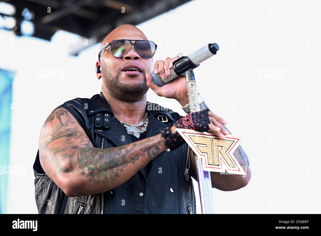 Flo Rida performs on stage during 3 to 5 on Ocean Drive as part of ...