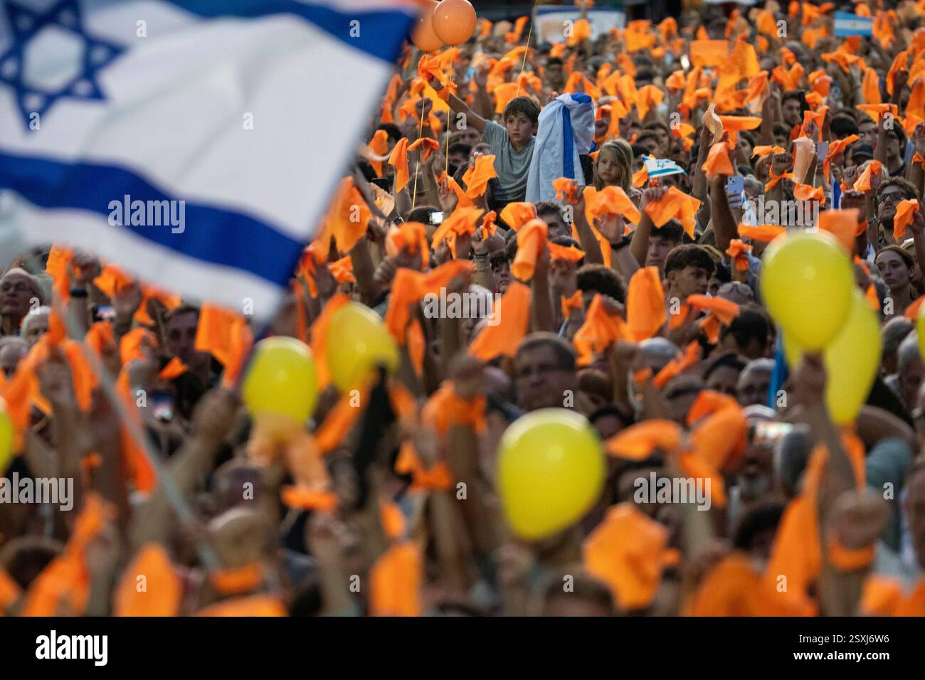 Members of the Jewish community gather in support of relatives of ...