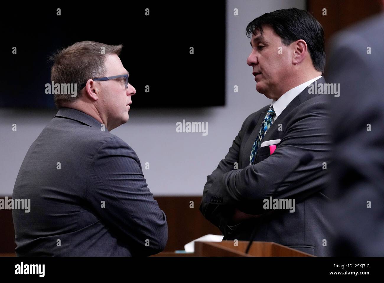Lake County, Ill., State's Attorney Eric Rinehart, left, talks with ...