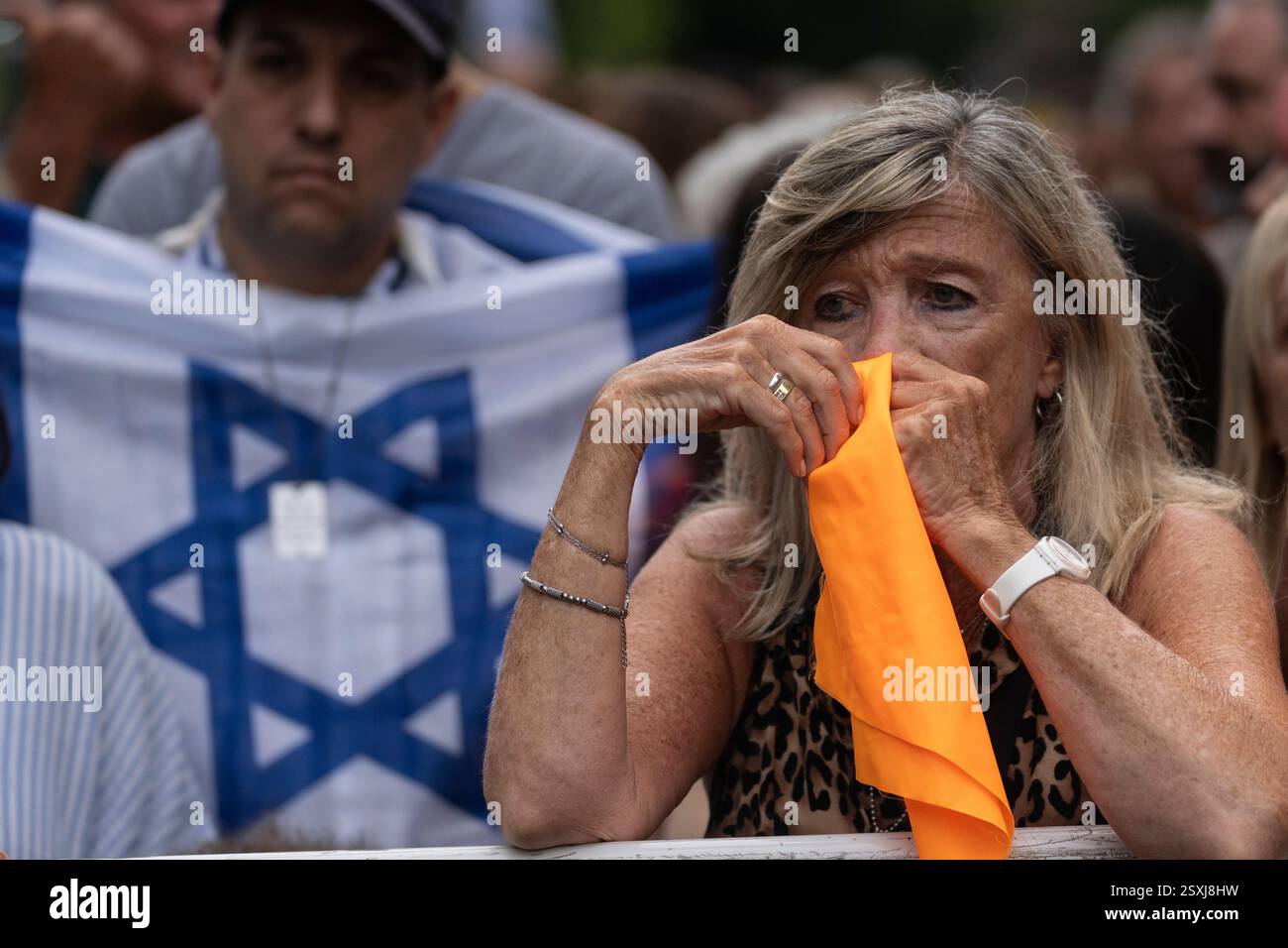 A woman gestures at an event in support of relatives of the hostages ...