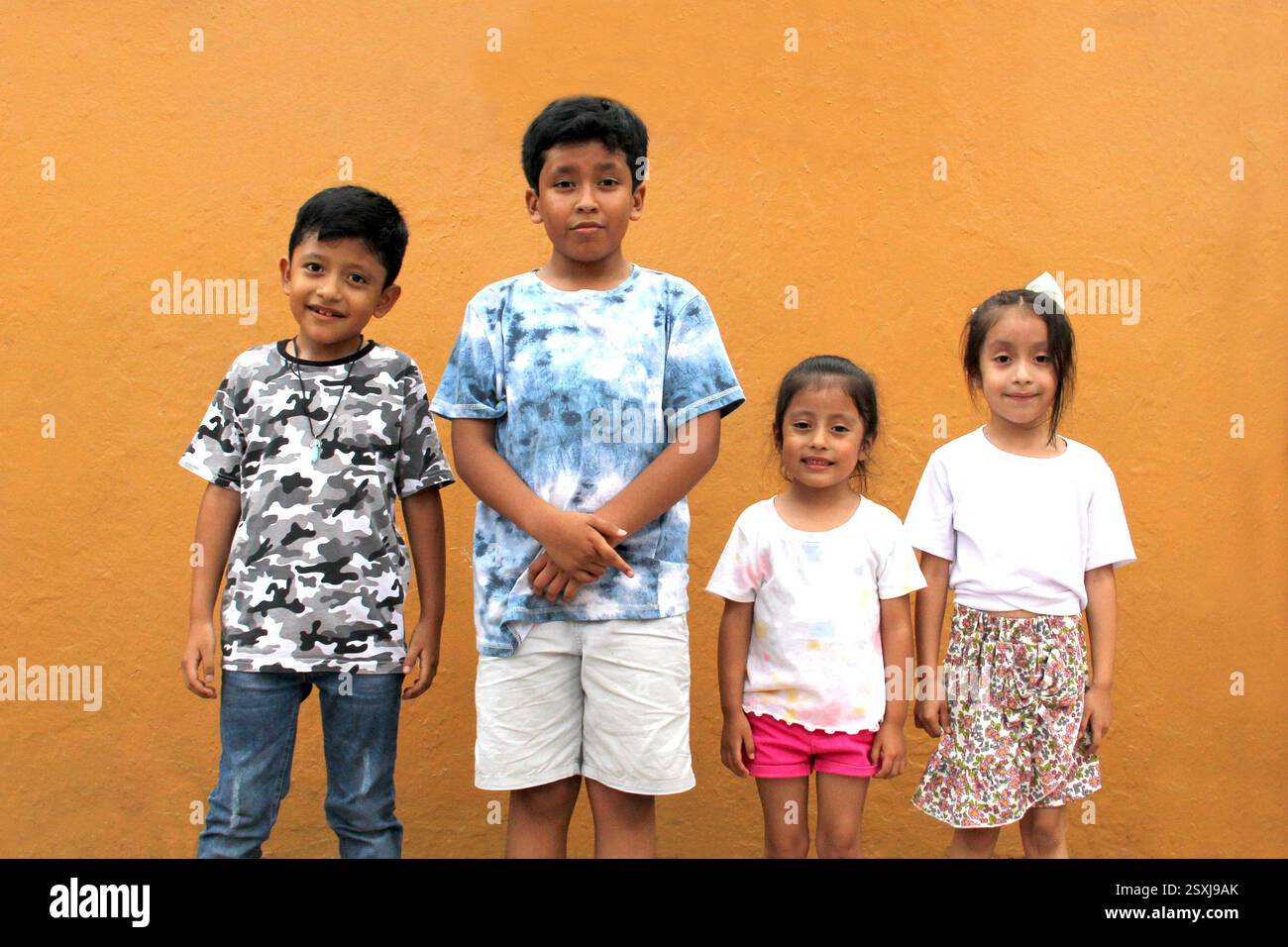 Boys and girls together play and have fun outdoors celebrating their ...