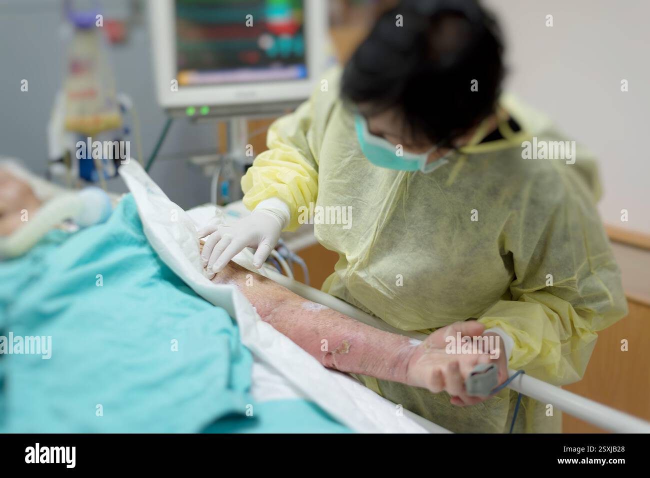 Asian women 40s years old in isolation gown non-sterile coat is a ...