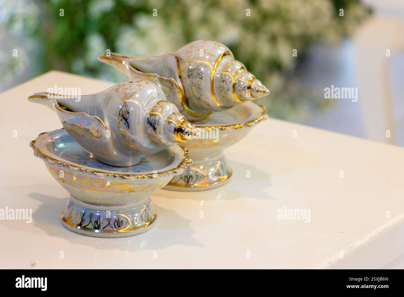 A two Conch shells and water bowls set for water Blessing in wedding ...