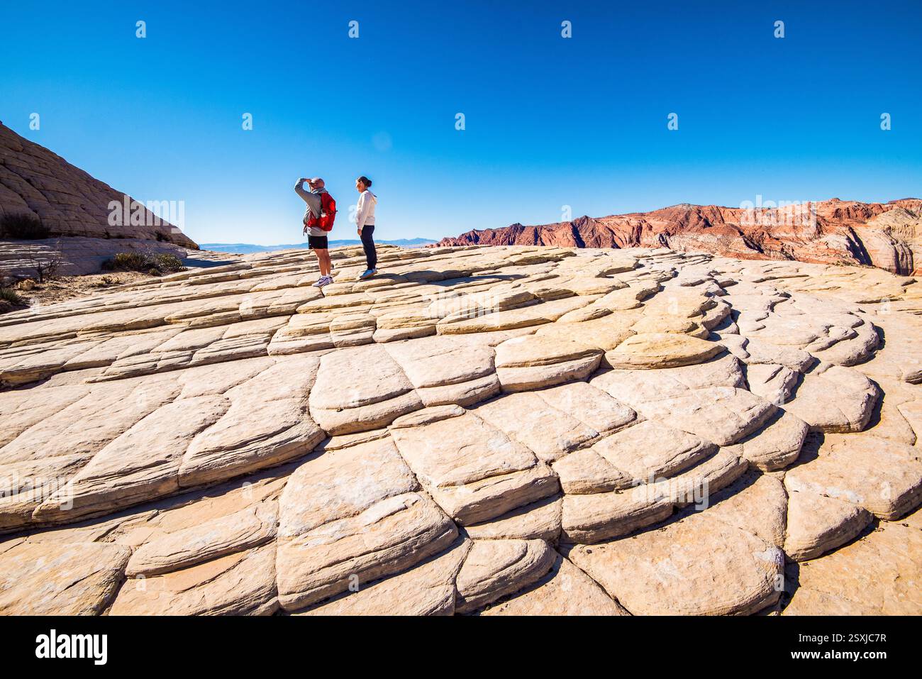 Hikers exploring the geologic wonders of Snow Canyon State Park. This ...