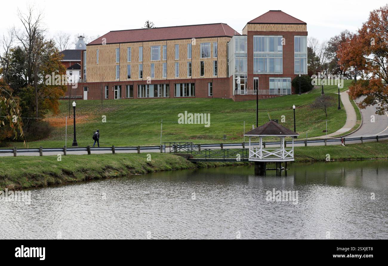 FILE - A person walks past Muskingum Lake at the Muskingum University ...