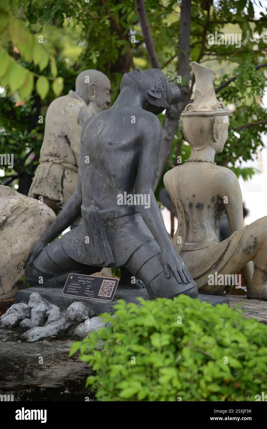 Statue of a hermit performing a massage therapy pose at Wat Phra ...