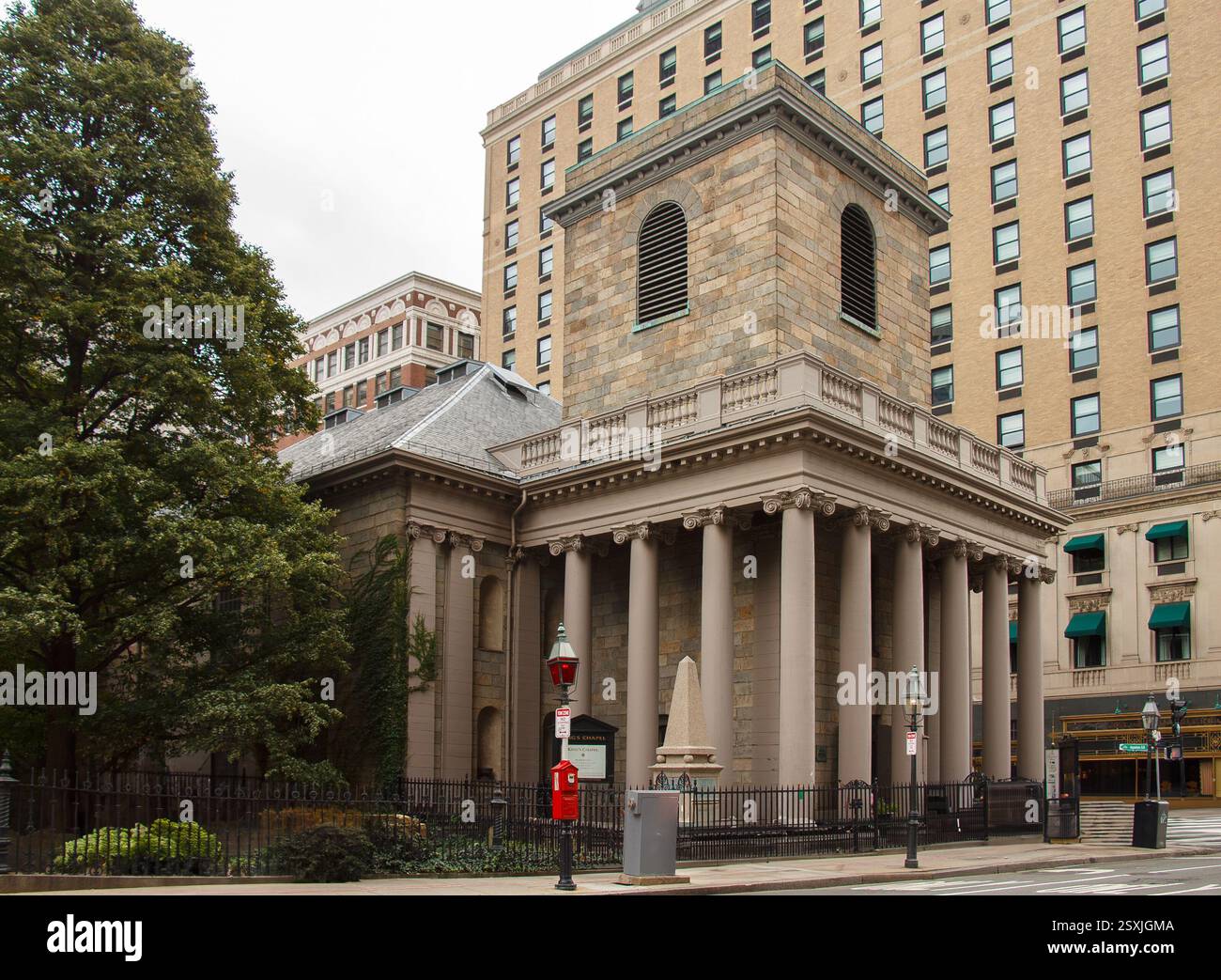 The Kings chapel with its ionic collonade, a skyscraper and office ...