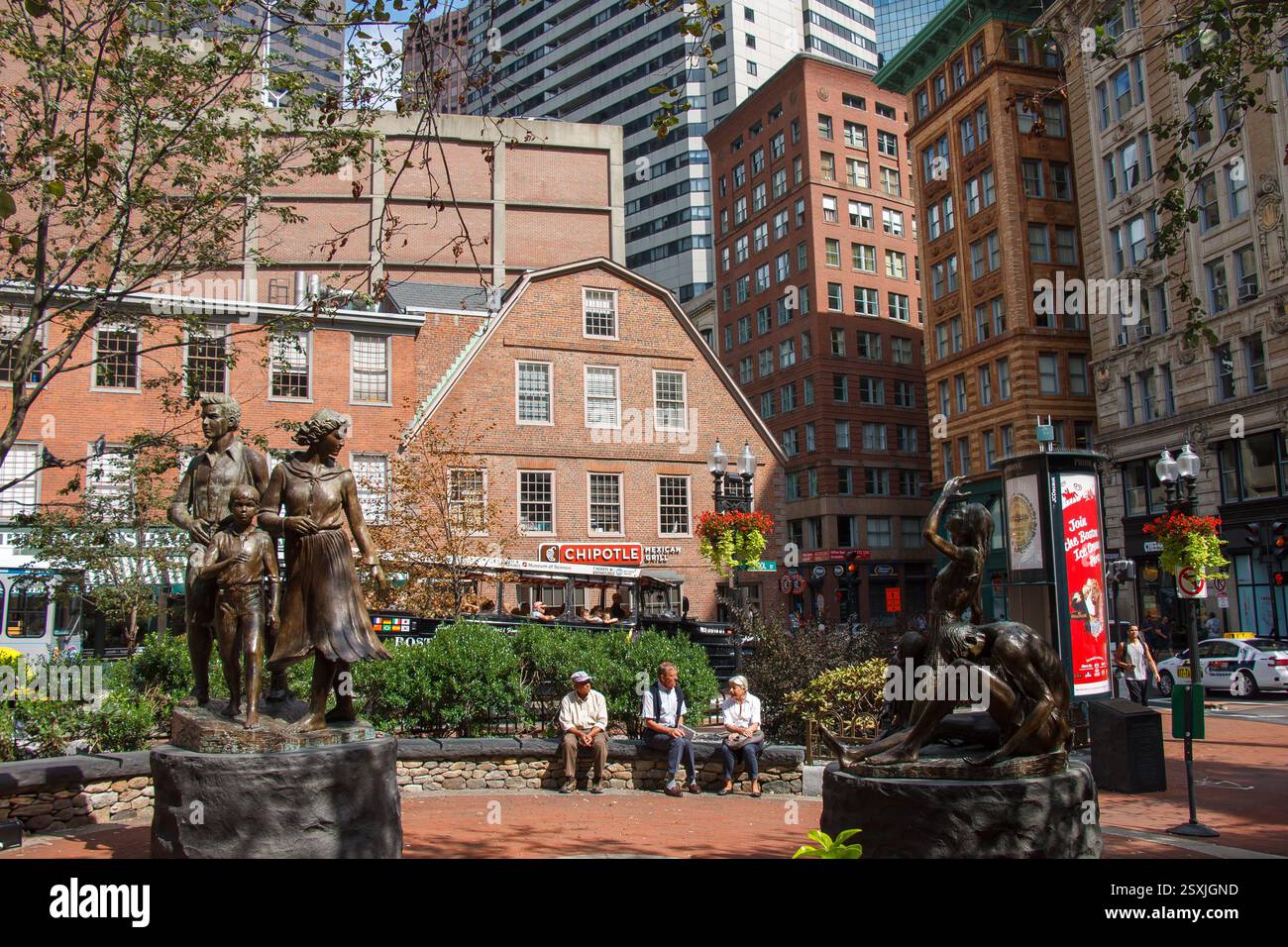 The Boston Irish famine memorial and the typical historical brick ...