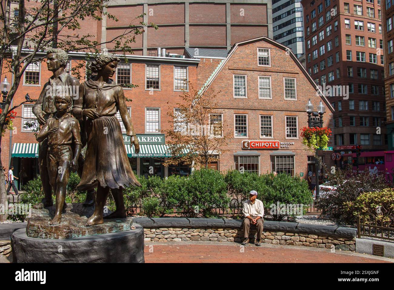 The Boston Irish famine memorial and the typical historical brick ...