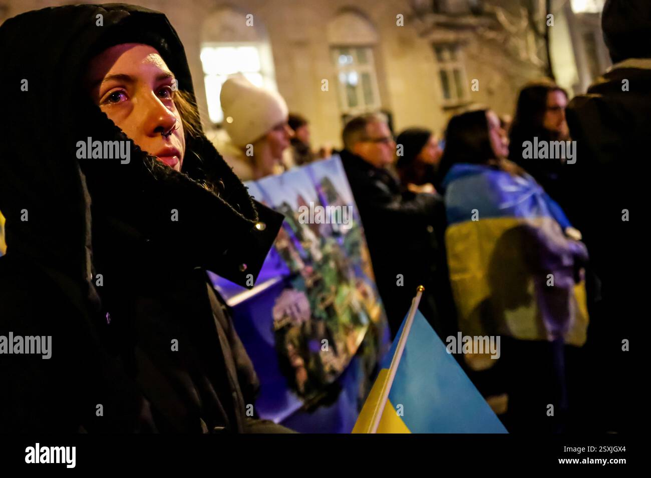A woman cries during the rally. People with placards and flags gathered ...
