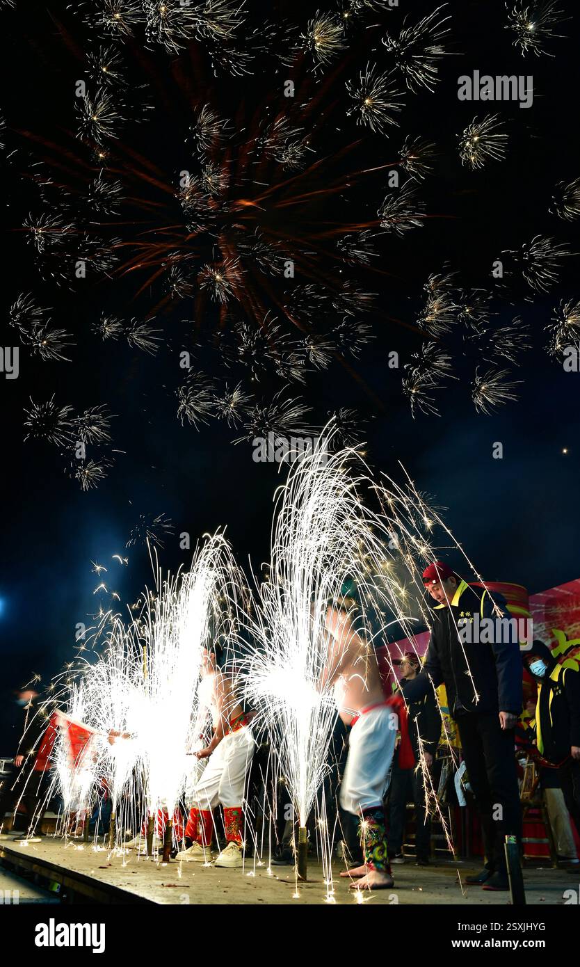 Putian,China.23th February 2025. Folk artists perform "firework eating ...
