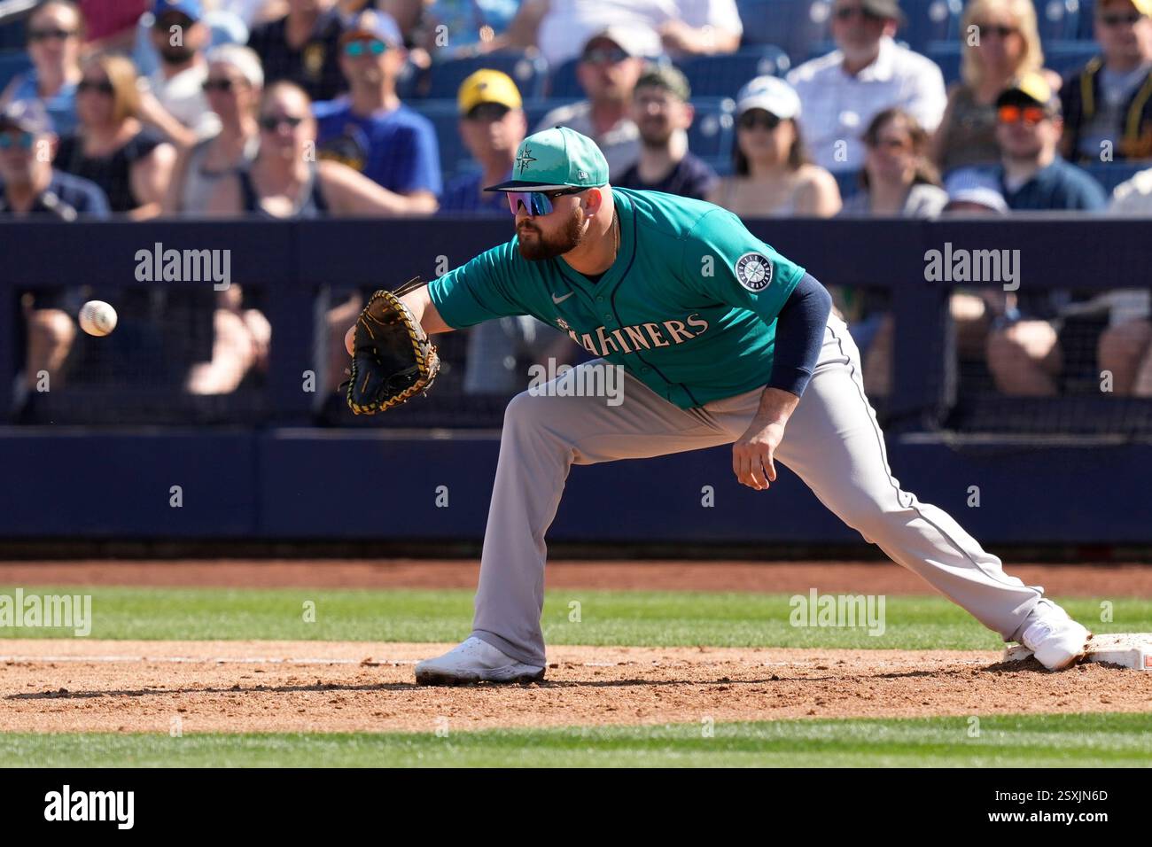 Seattle Mariners first baseman Rowdy Tellez catches a throw to get ...
