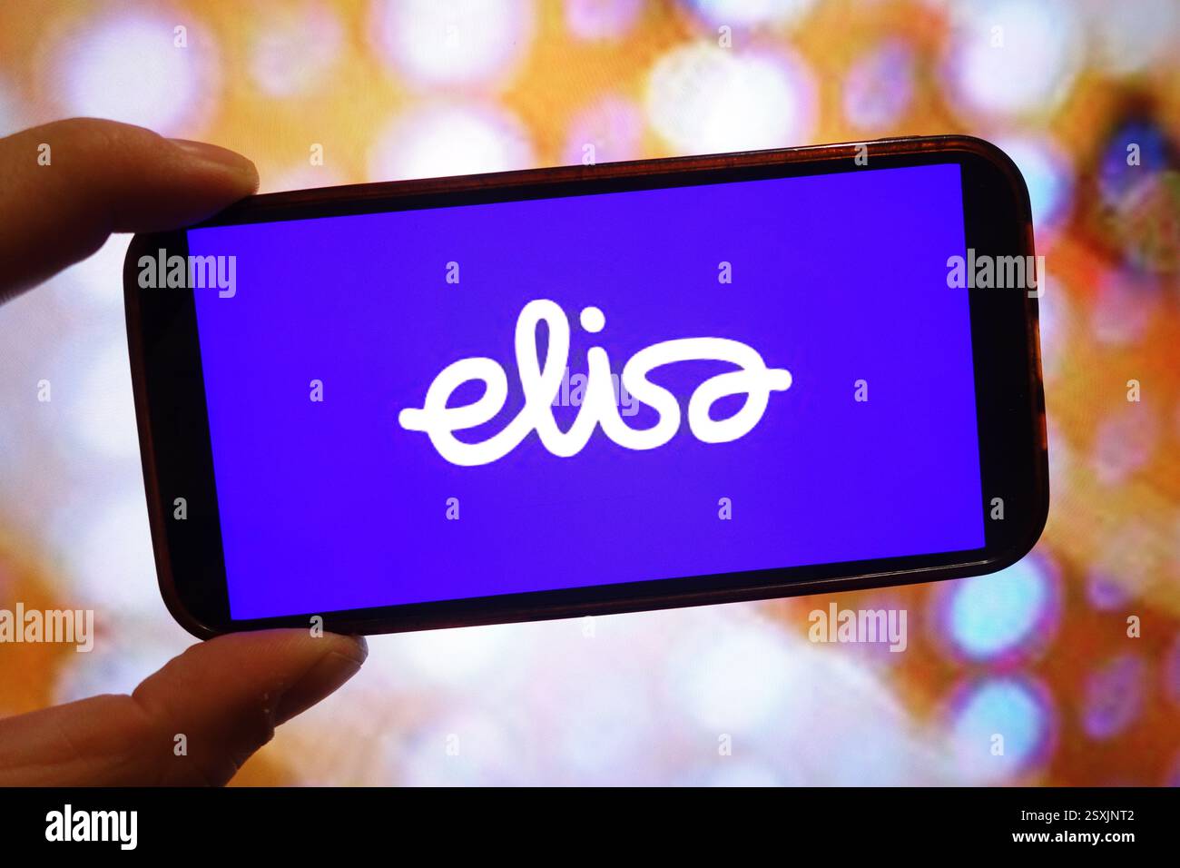 In this photo illustration, the Elisa Corporation company logo is seen ...