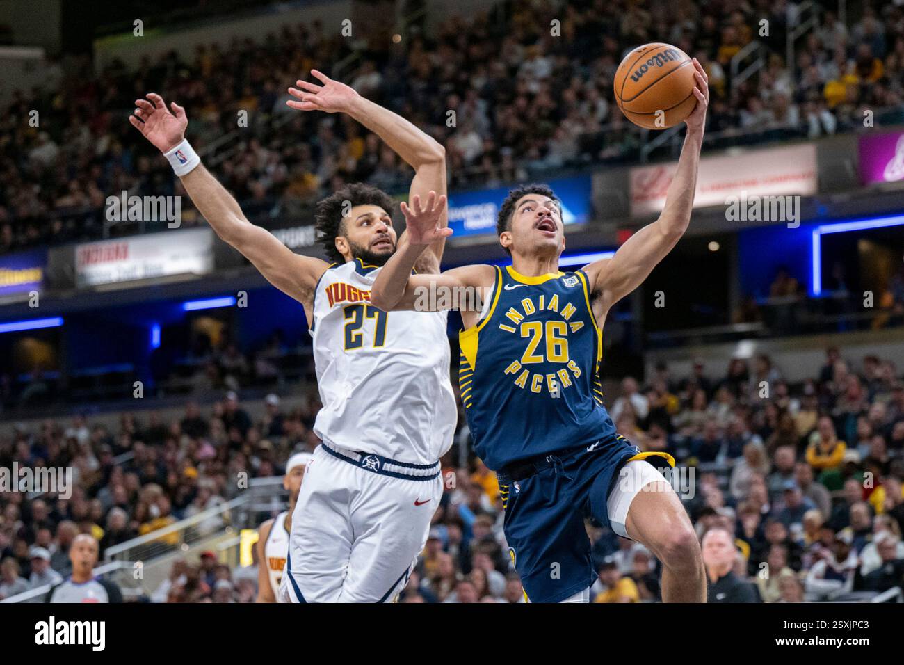 Indiana Pacers guard Ben Sheppard (26) shoots while defended by Denver ...