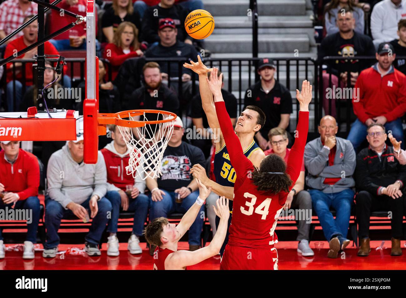Michigan center Vladislav Goldin (50) shoots over Nebraska guard Connor ...