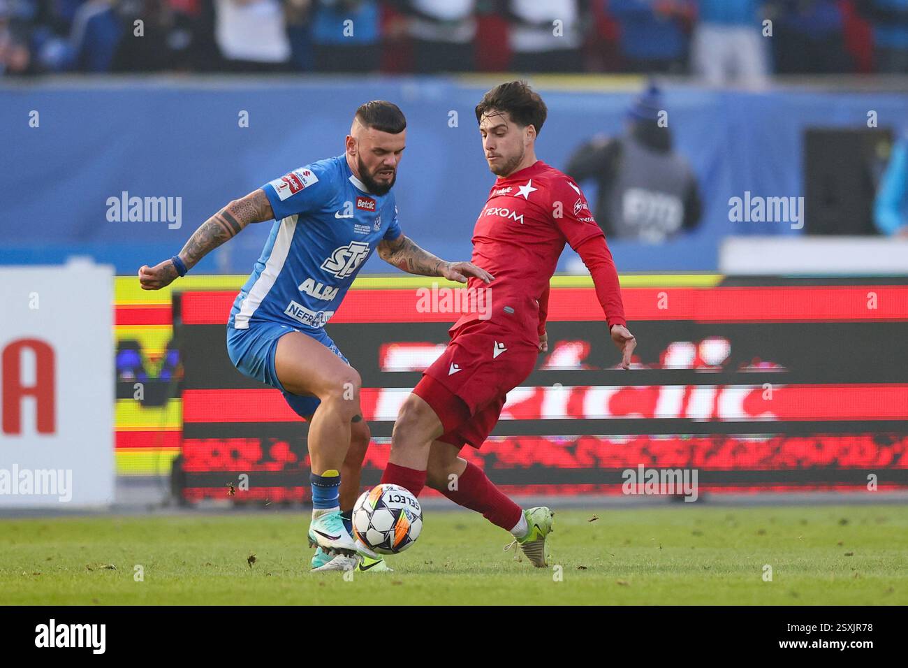 Chorzow, Poland. 22nd Feb, 2025. Milosz Kozak of Ruch Chorzow (L) and ...