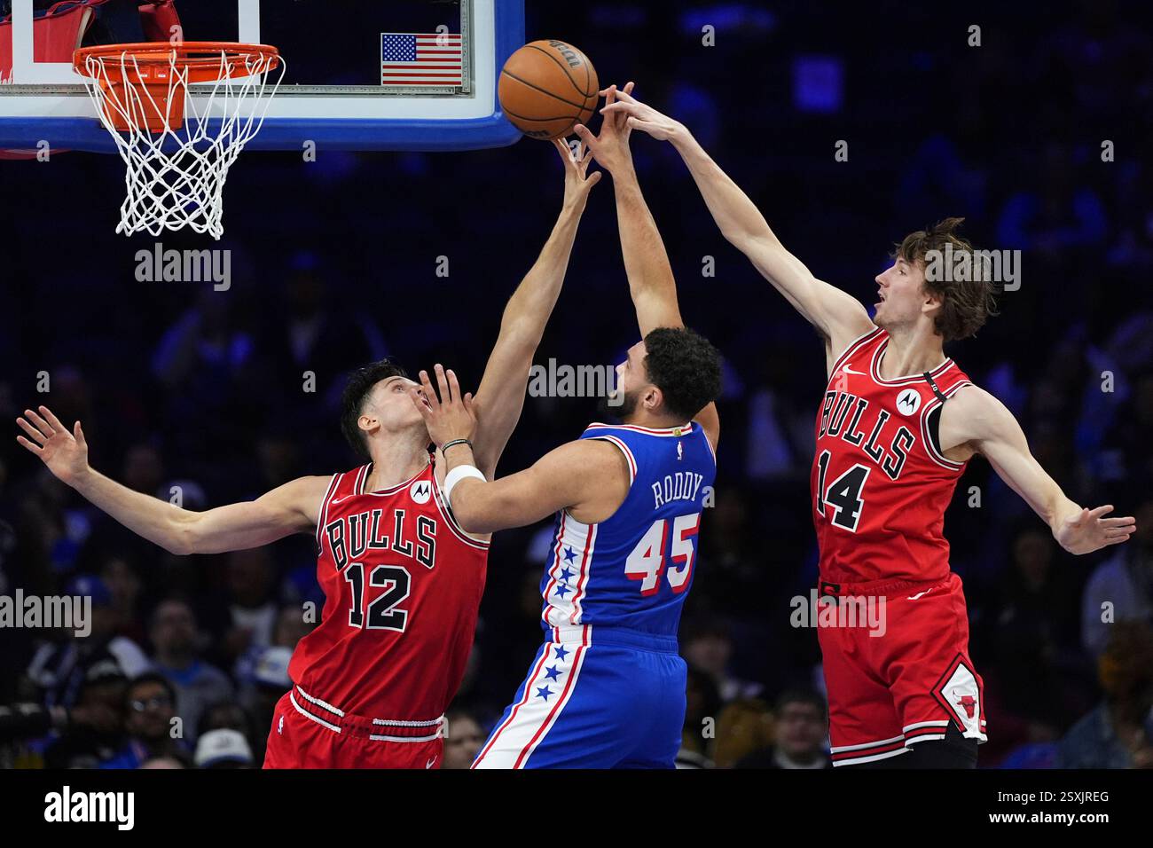 Philadelphia 76ers' David Roddy, center, cannot get a shot past Chicago ...