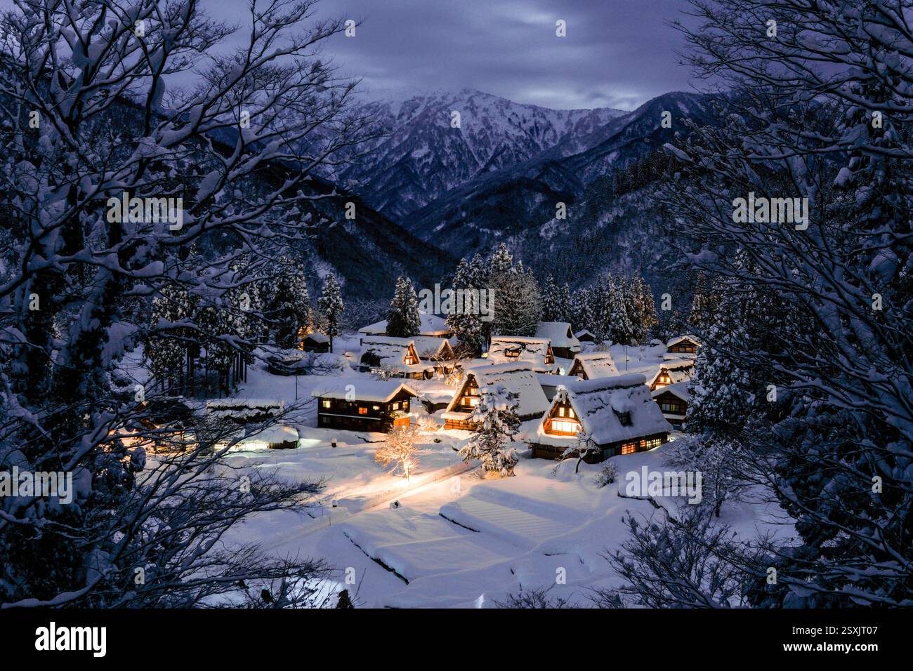 A photo of Ainokura village at dusk during snowfall, showcasing the ...