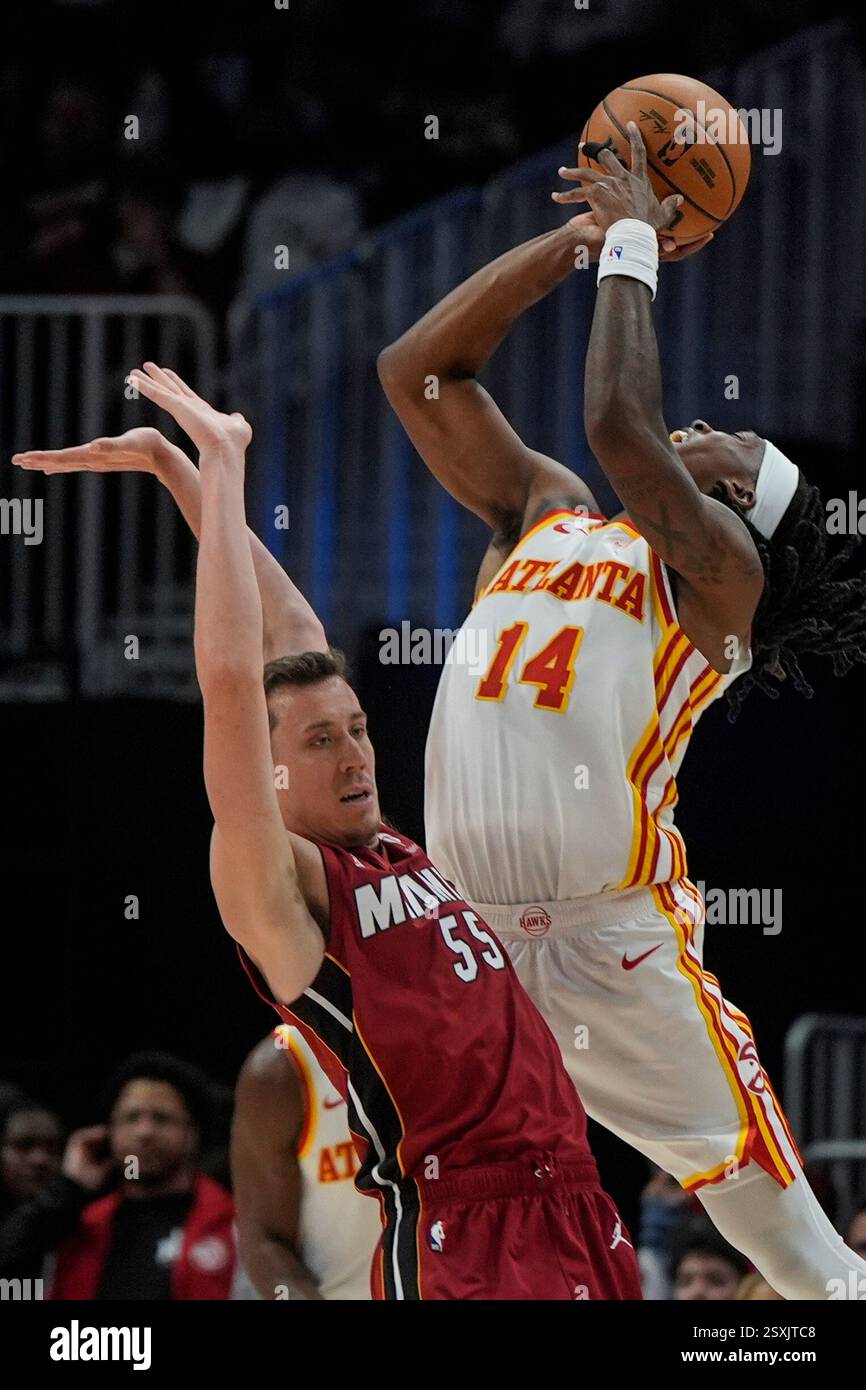 Atlanta Hawks guard Terance Mann (14) shoots against Miami Heat forward Duncan Robinson (55 ...