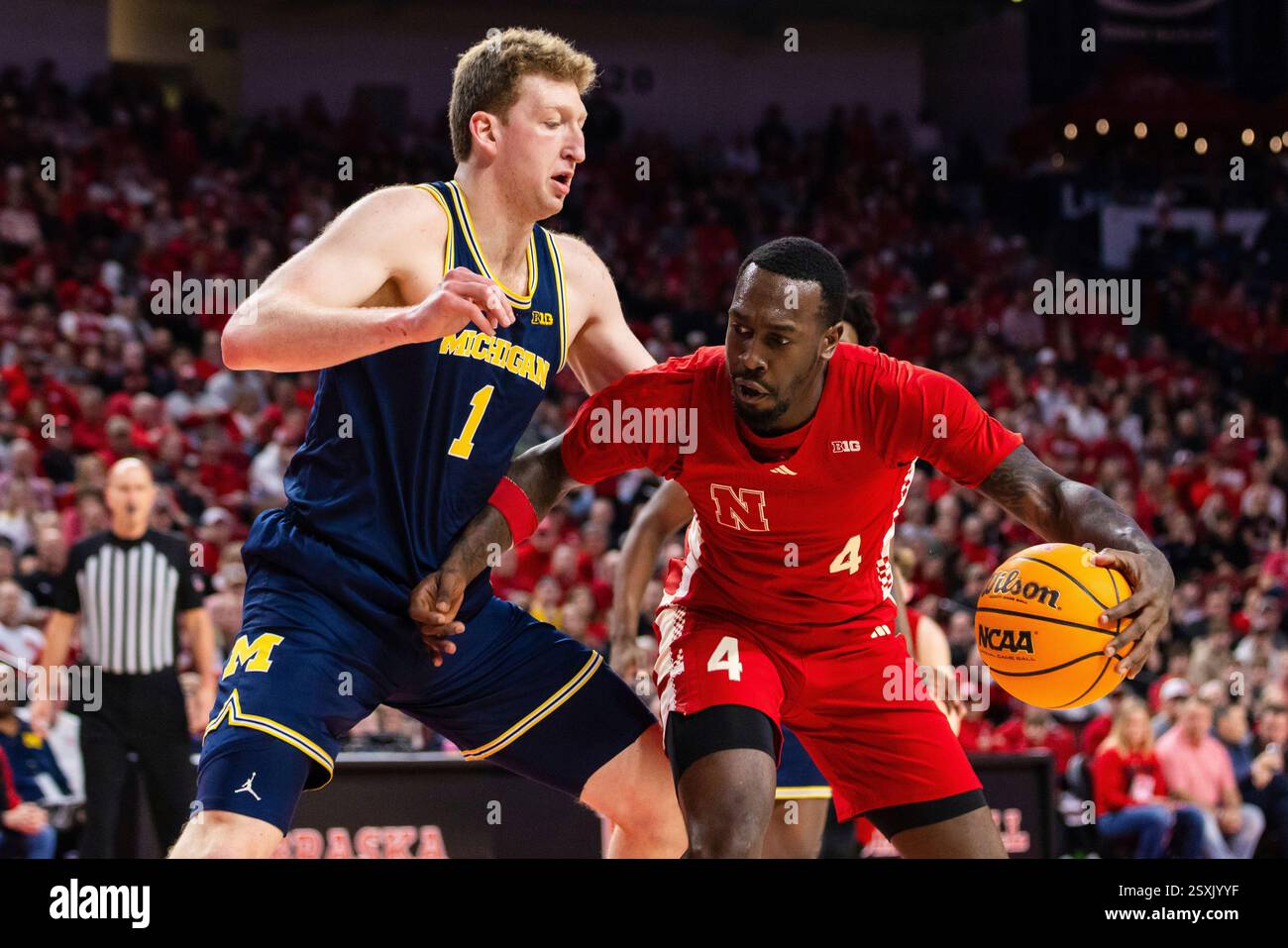 Nebraska forward Juwan Gary (4) drives against Michigan center Danny ...