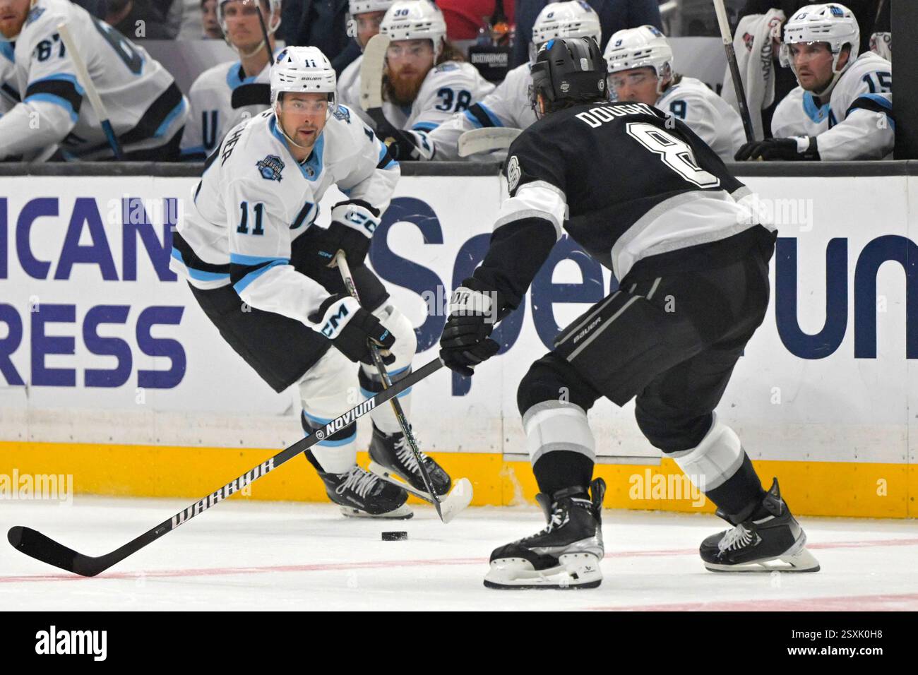 Utah Hockey Club right wing Dylan Guenther (11) controls the puck past ...
