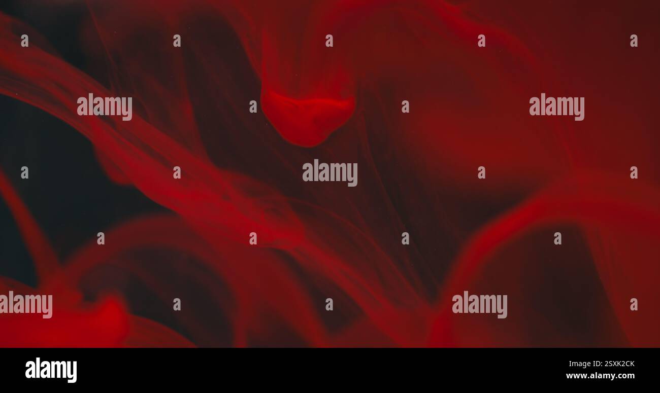 Blur fluid haze. Ink water explosion. Defocused red color glow liquid ...
