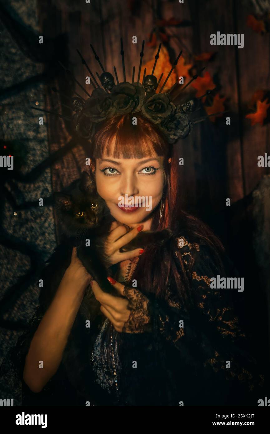 Black cat holding red hi-res stock photography and images - Alamy