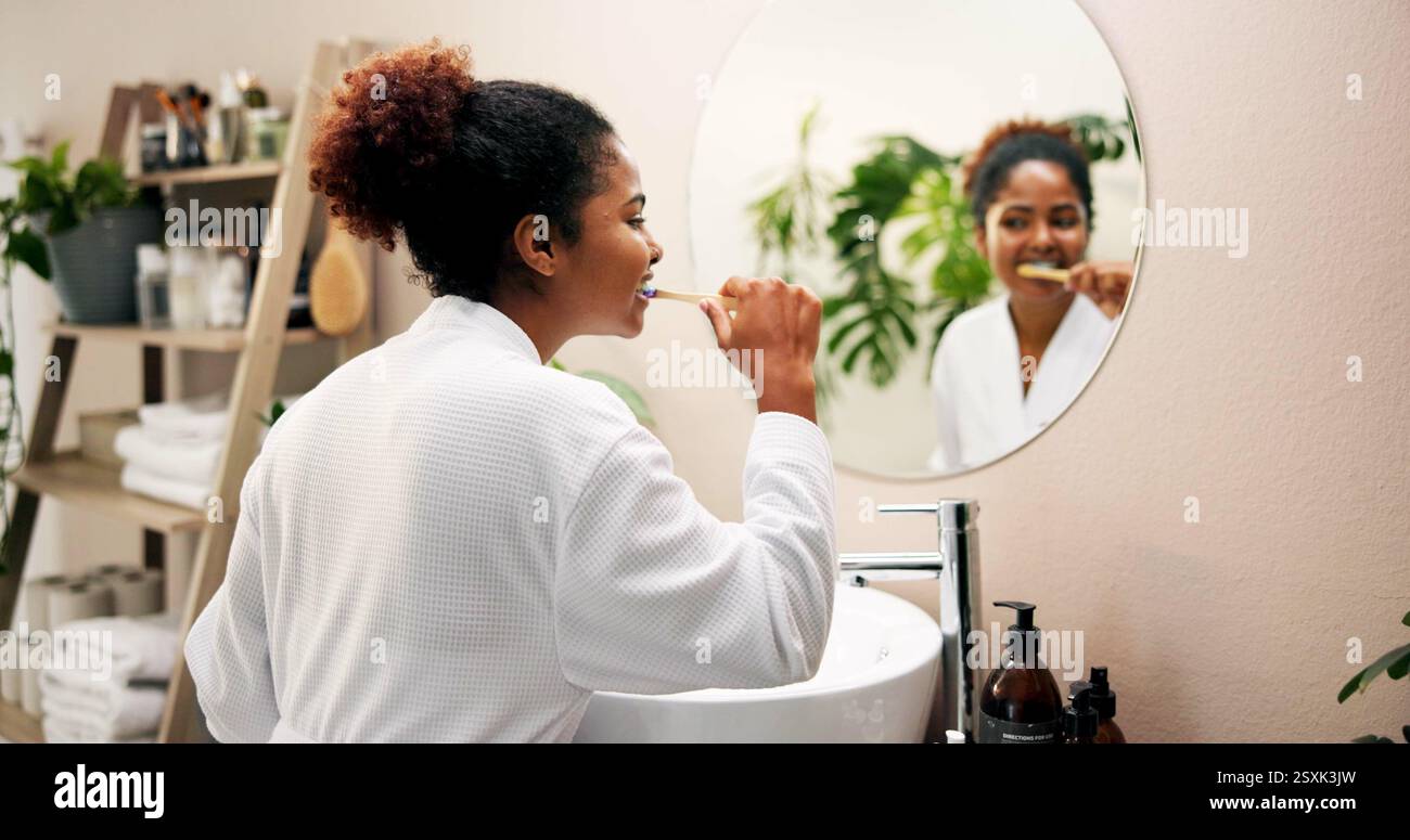 Dental care, mirror and black woman brushing teeth in home for morning routine, fresh breath or ...