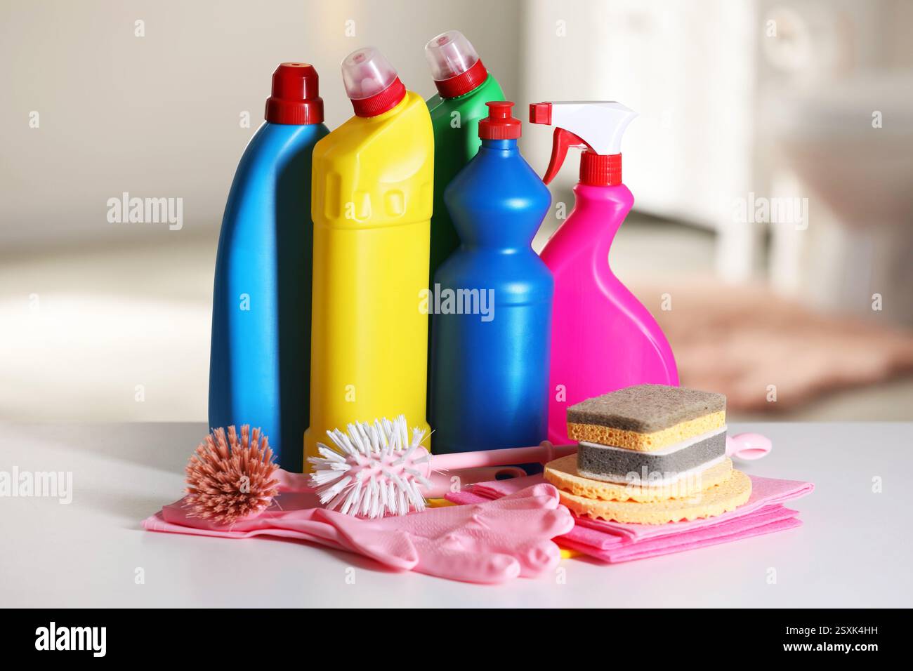 Different detergents and cleaning supplies on table in bathroom Stock ...
