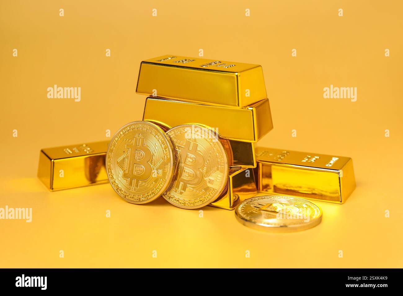 Gold bars and coins on golden background Stock Photo - Alamy