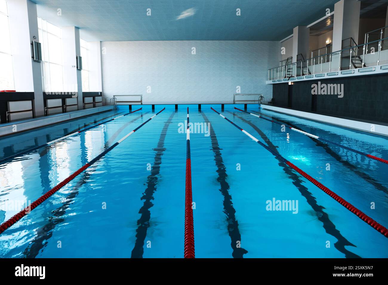 Swimming pool with clean water and lane dividers indoors Stock Photo ...