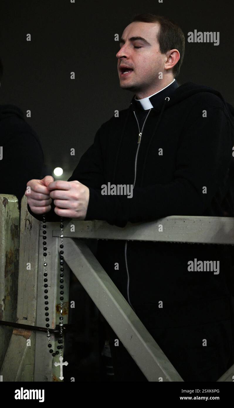 Faithful attend a nightly rosary prayer led by Vatican's Secretary of ...
