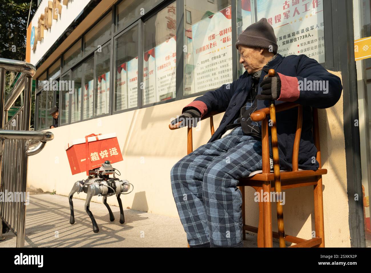 Hangzhou,China.24th February 2025. Robotic dog "Xiao Xi" delivers items ...