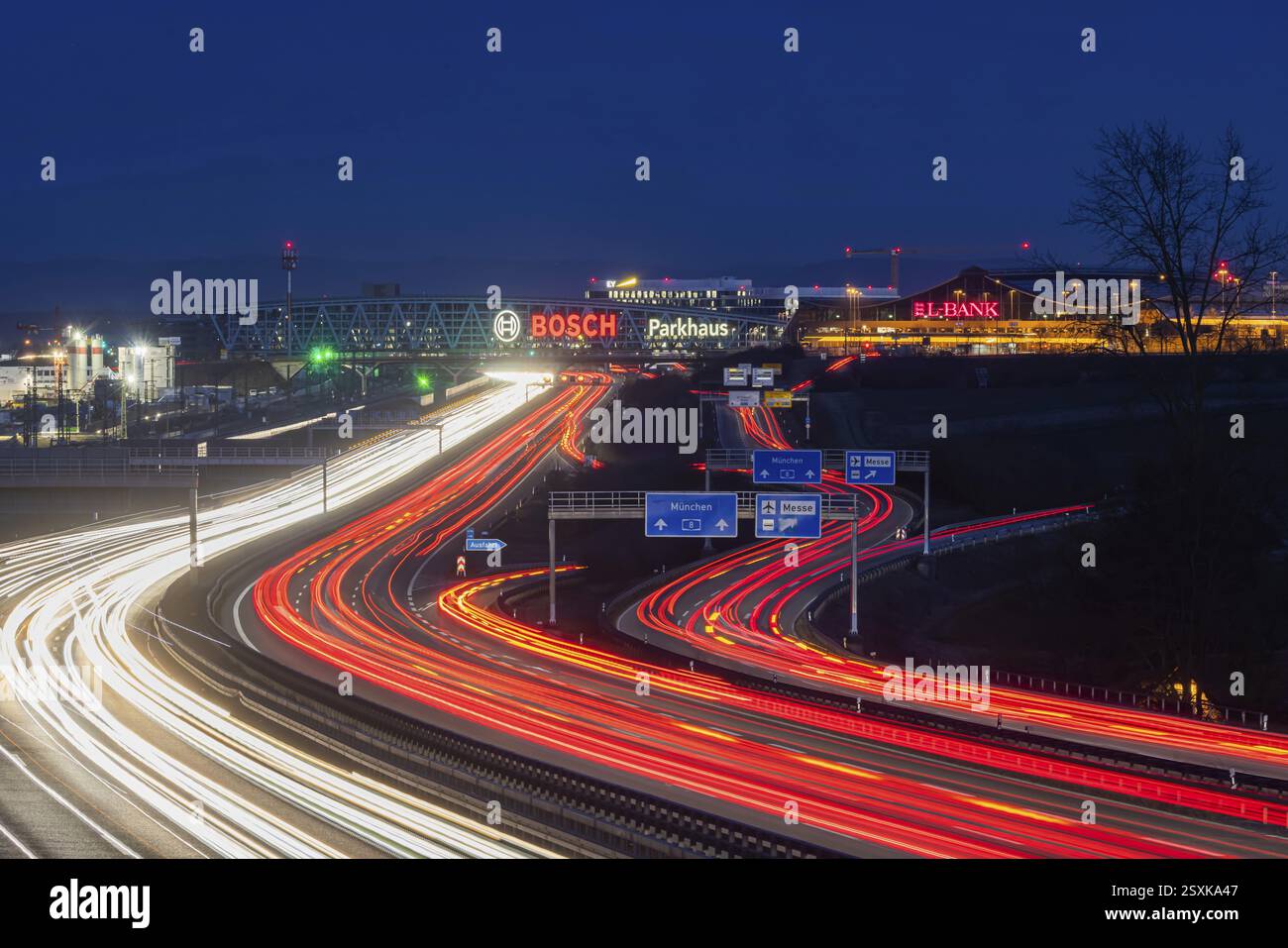 A8 motorway at Stuttgart Airport in the evening. Heavy traffic, lanes ...