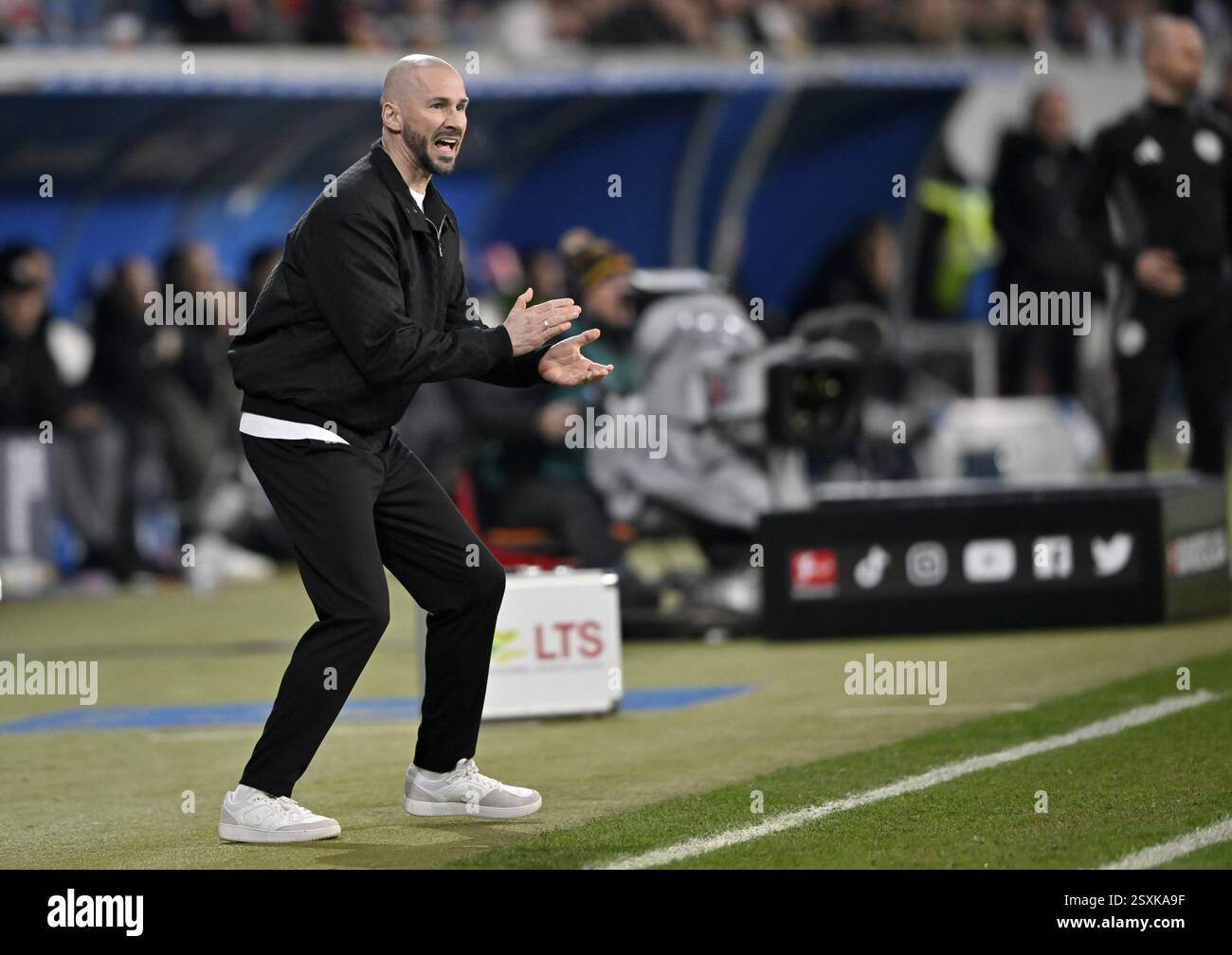 Coach Christian Ilzer TSG 1899 Hoffenheim on the sidelines clapping his ...