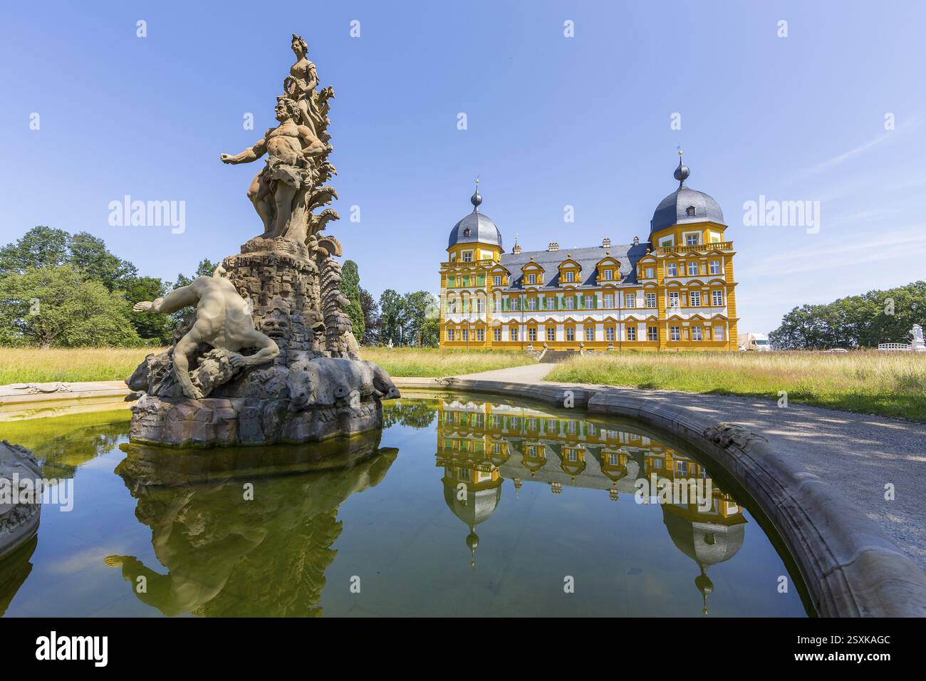 Park view of Seehof Castle with reflection in a water basin of the ...